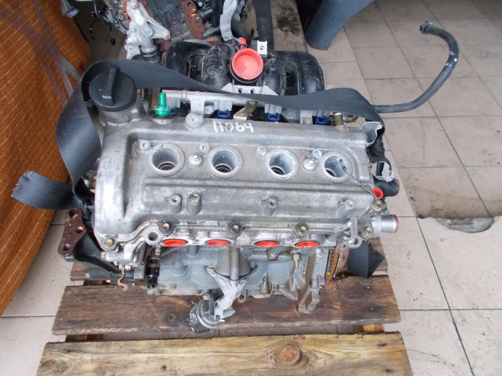 SILNIK TOYOTA YARIS 1.0 1SZ-FE 1S-52L 11411-0J030 - 7164446083 ...